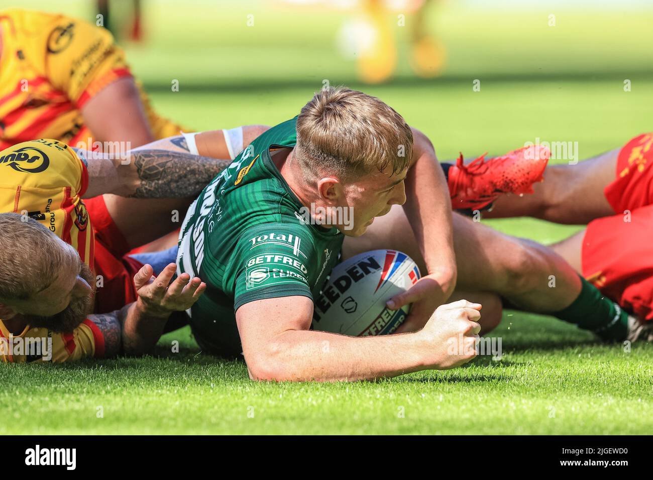 Matthew Nicholson #35 of Warrington Wolves goes over for a try on his ...