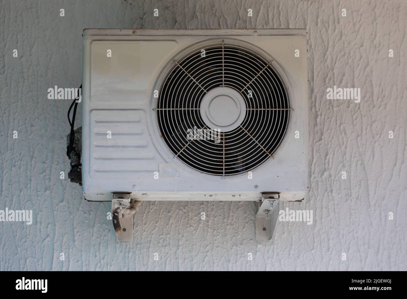 old outdoor air conditioner unit hanging outside the building Stock ...
