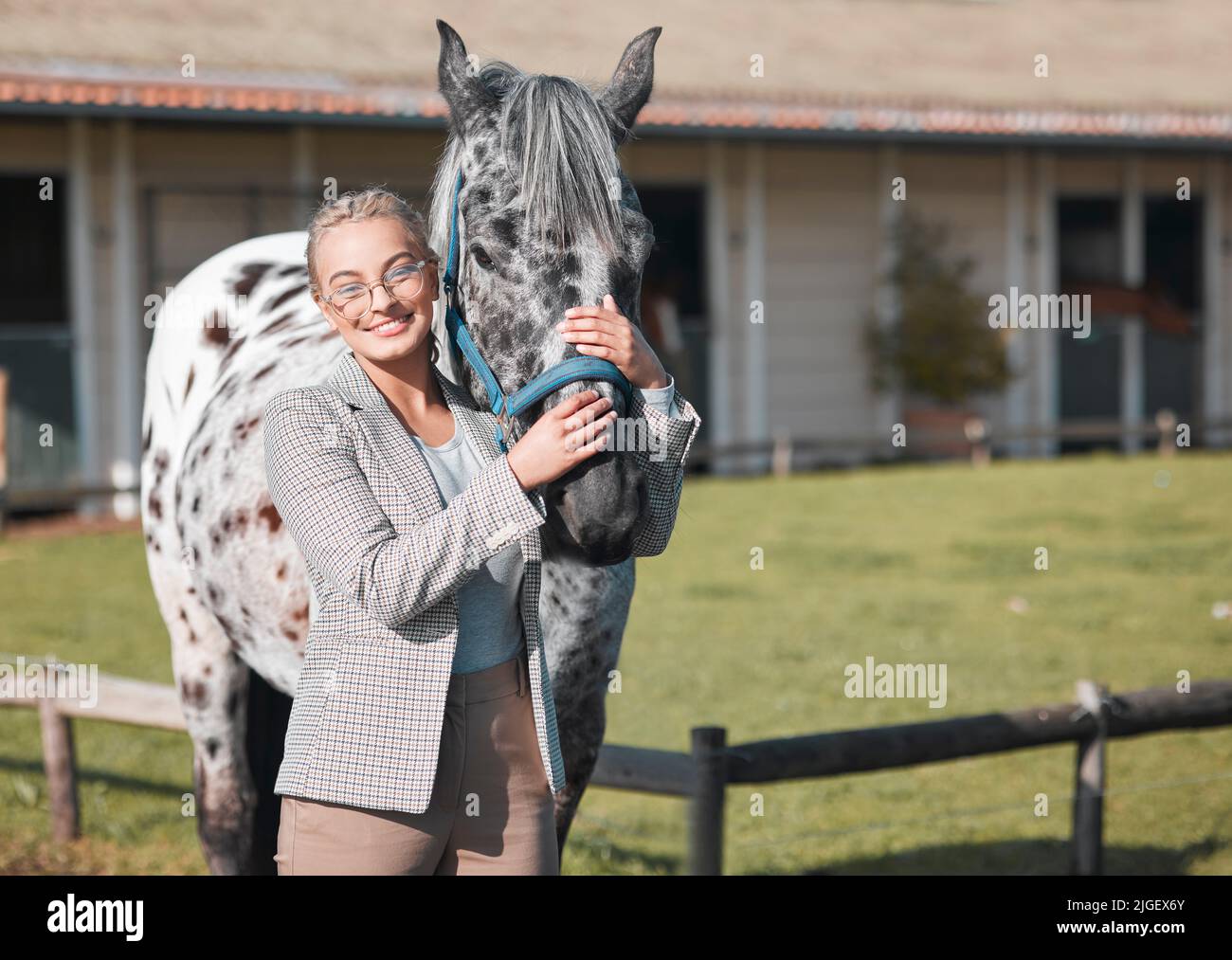 Meet my stallion. Portrait of an attractive woman posing with a horse ...