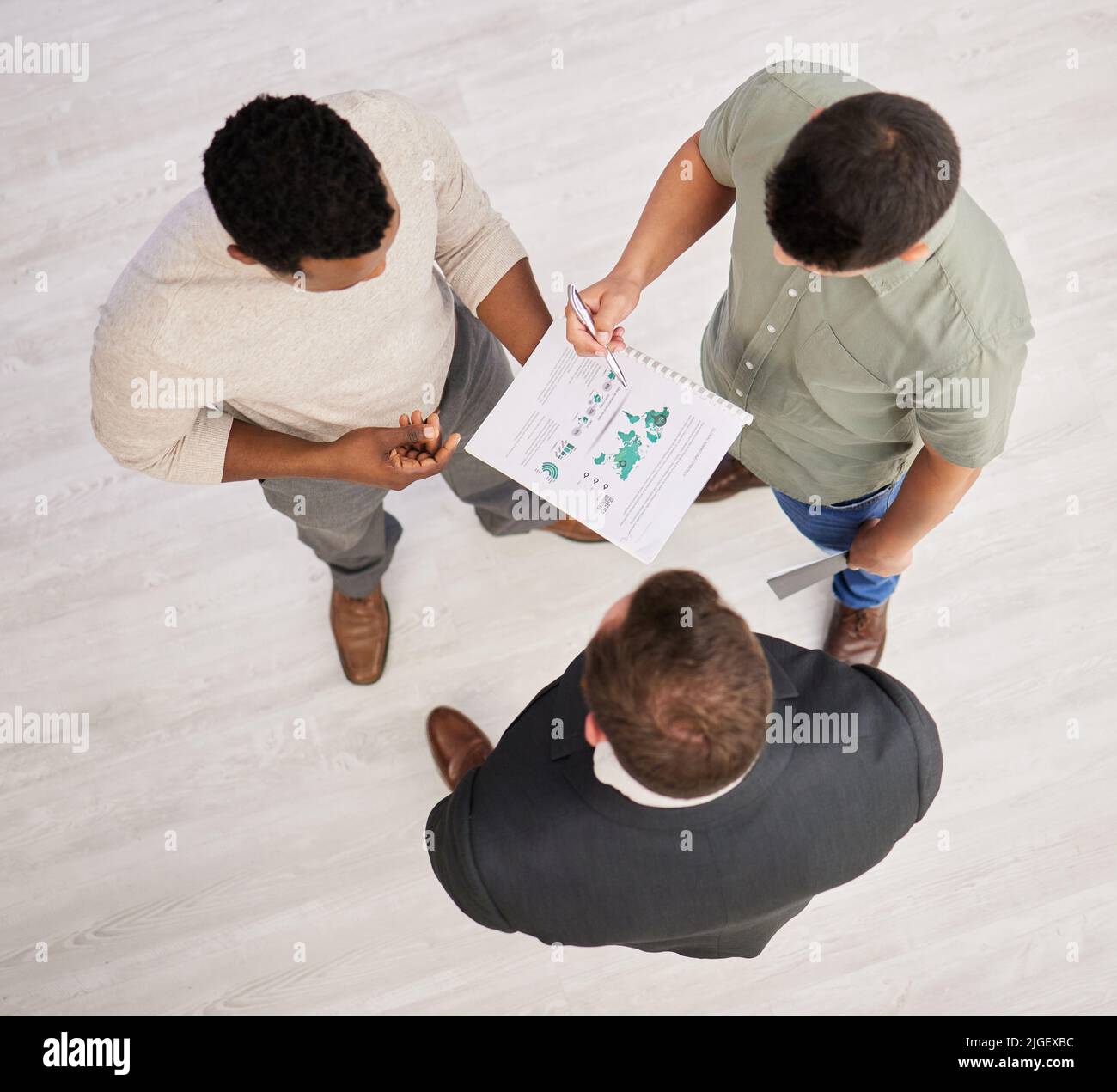 The answers lie in the numbers. High angle shot of three unrecognizable ...