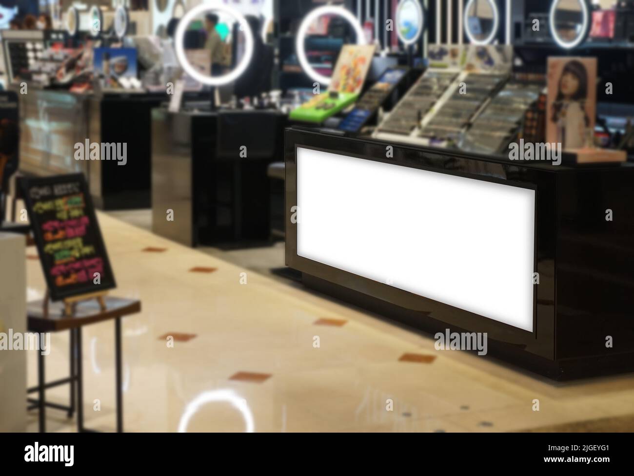 Advertising poster board inside department store Stock Photo - Alamy