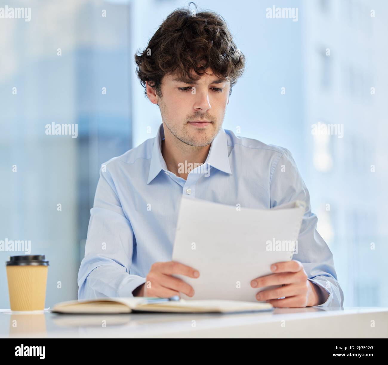 Creative man reading documents working hi-res stock photography and ...