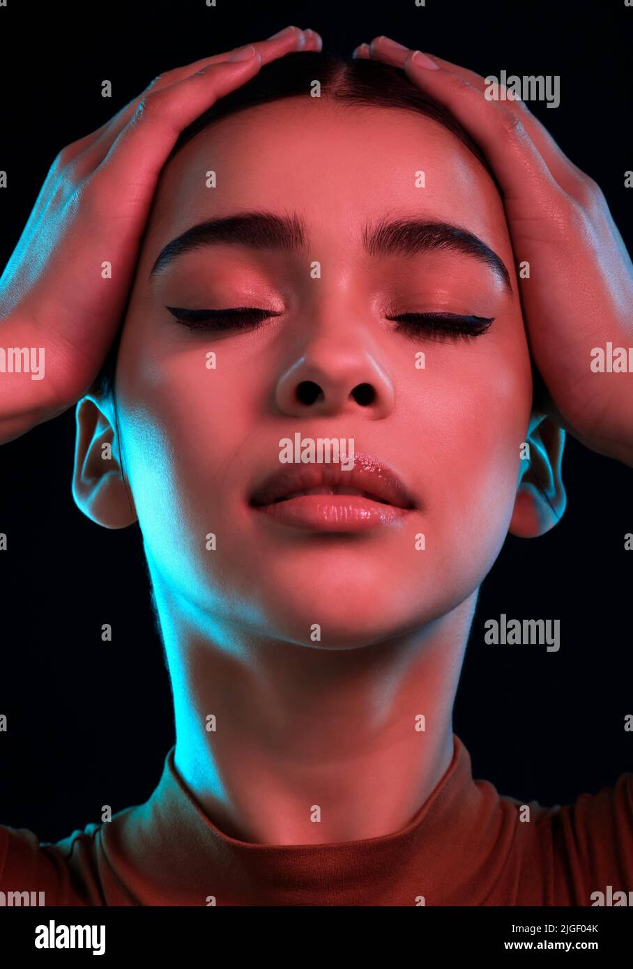 In her creative space. an attractive young female ballerina practicing ...