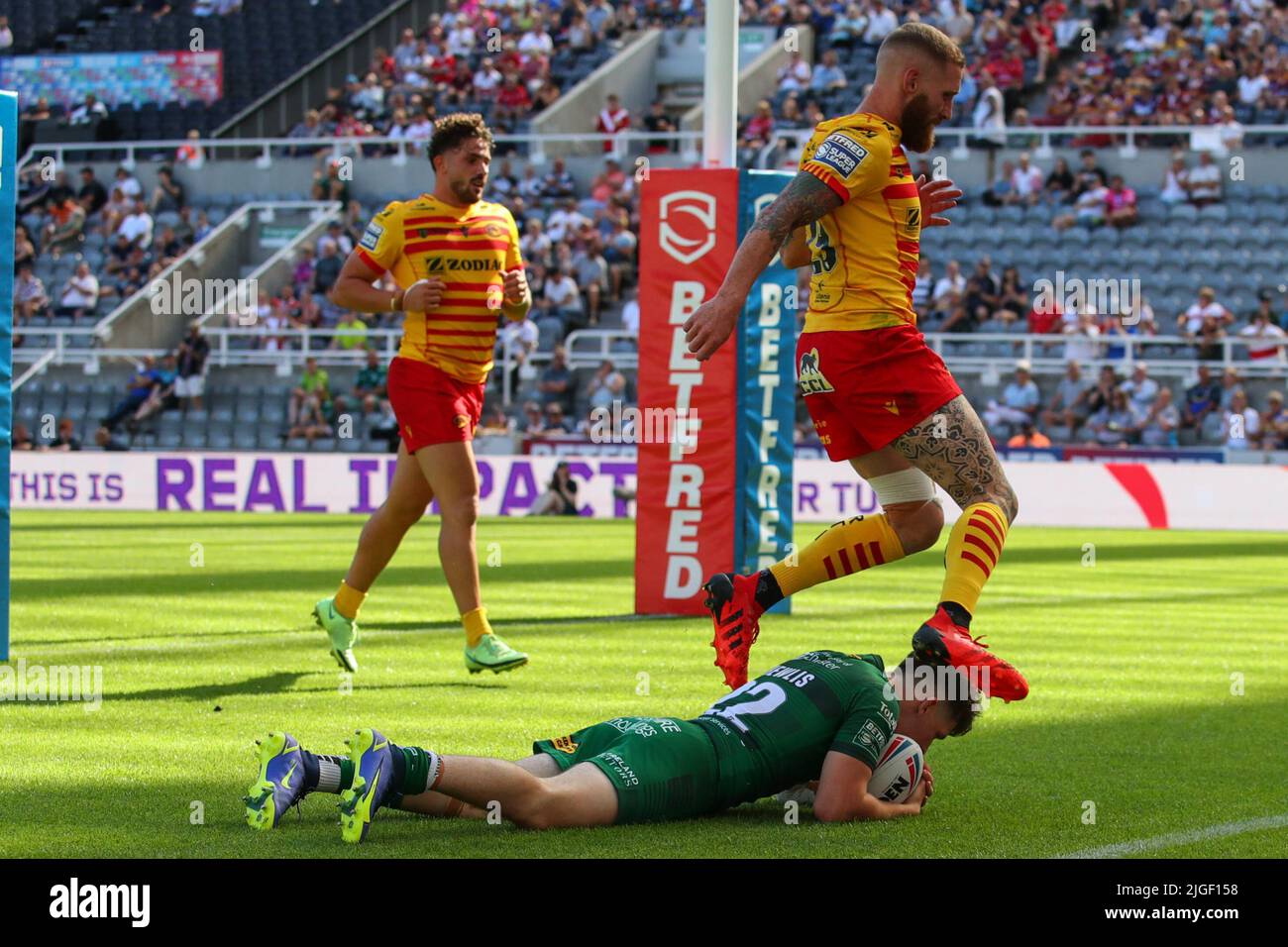 Josh Thewlis #22 of Warrington Wolves runs the length of the pitch to ...