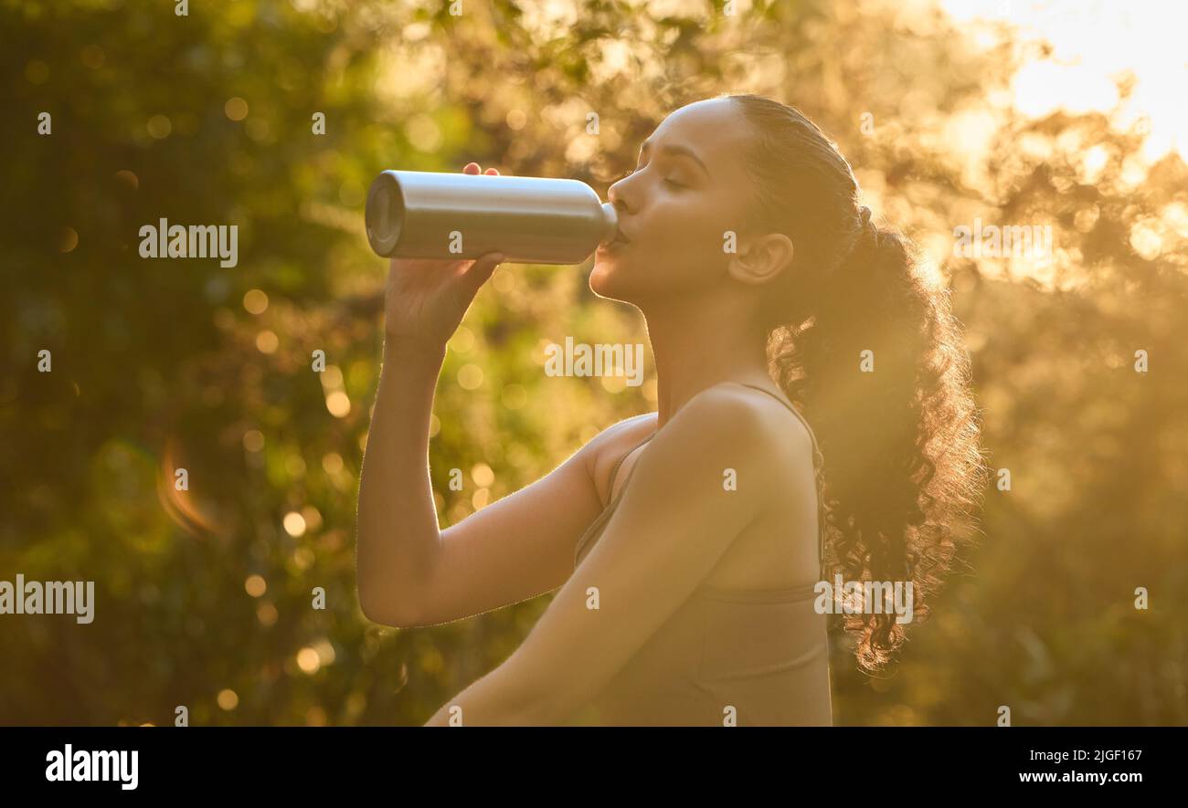 Im feeling thirsty after that glorious run. a sporty young woman ...