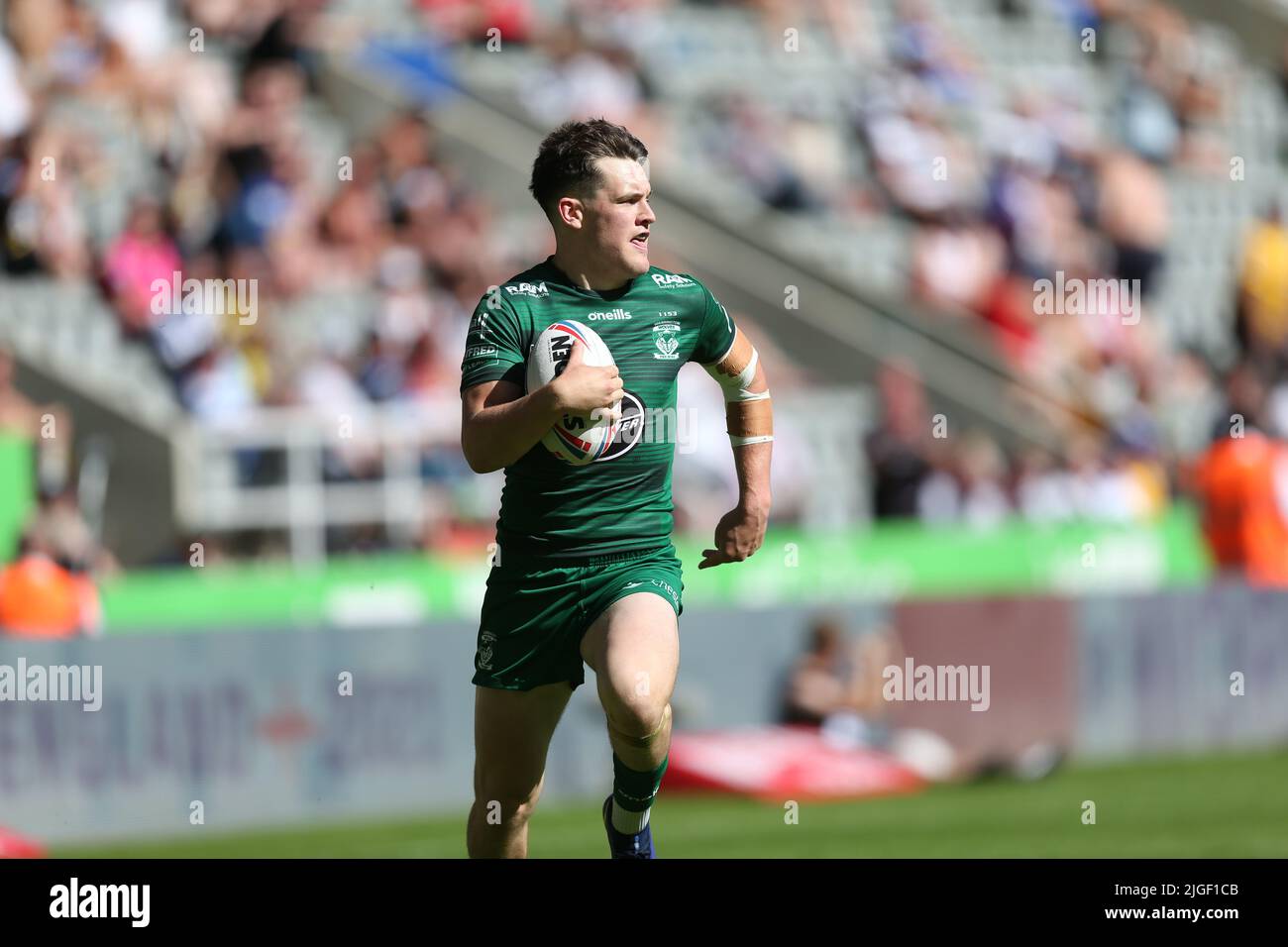 Josh Thewlis #22 of Warrington Wolves runs the length of the pitch to ...