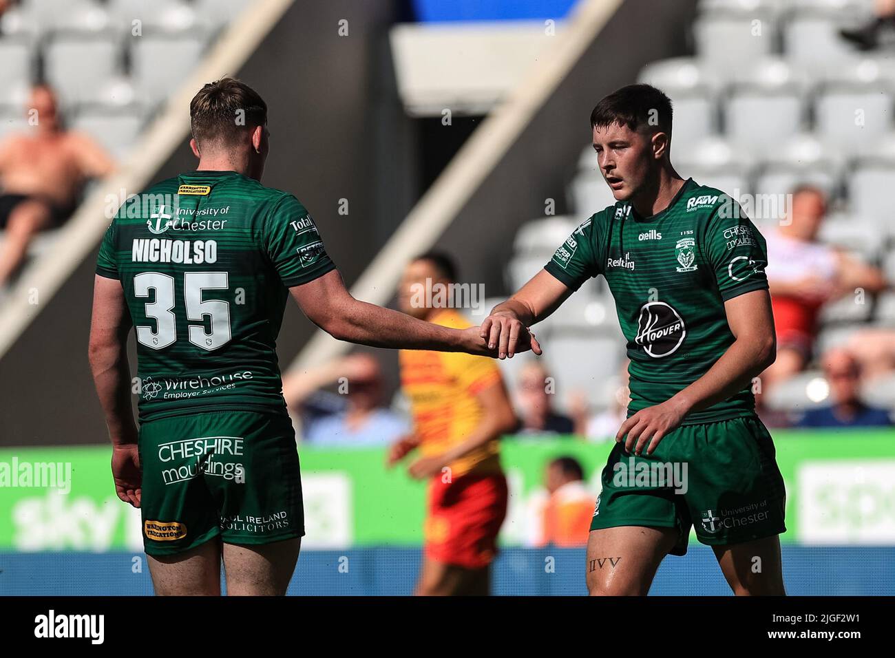 Matthew Nicholson #35 of Warrington Wolves and Riley Dean #27 of ...