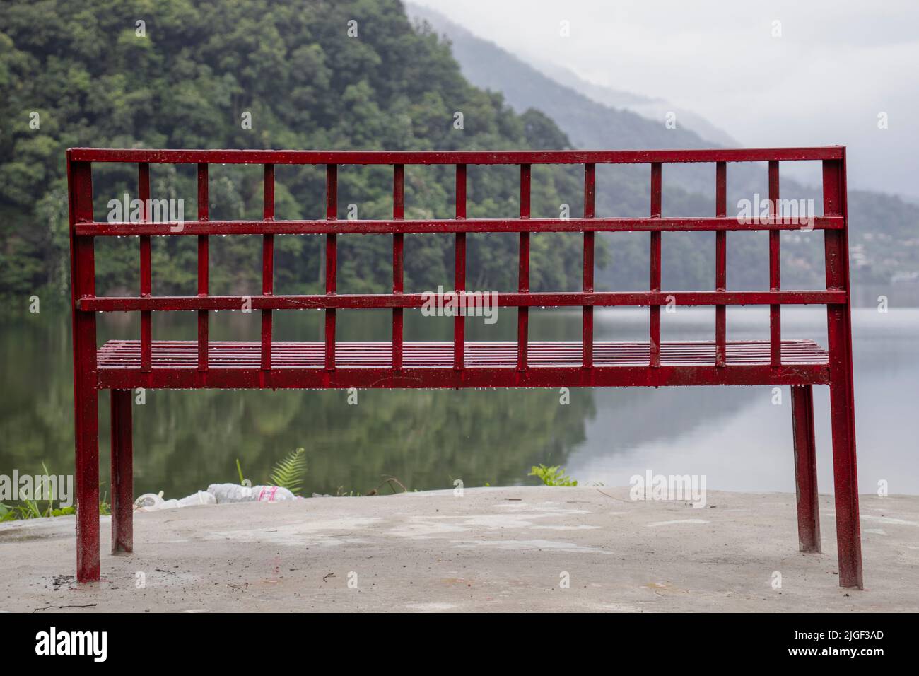 Red bench near a lake Stock Photo - Alamy