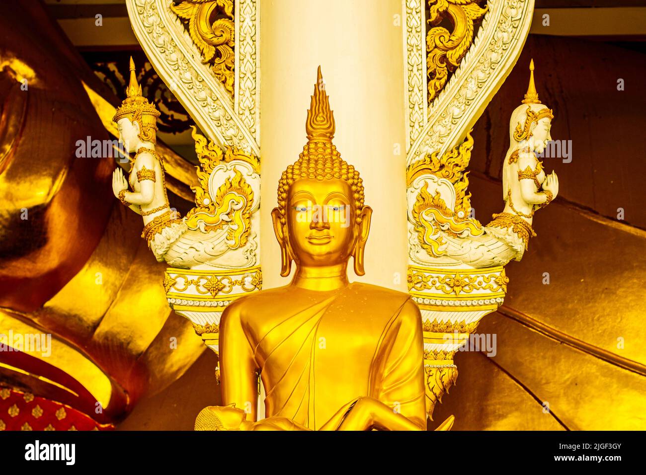 close up Golden buddha statue in religiuus asian temple decoration with ...
