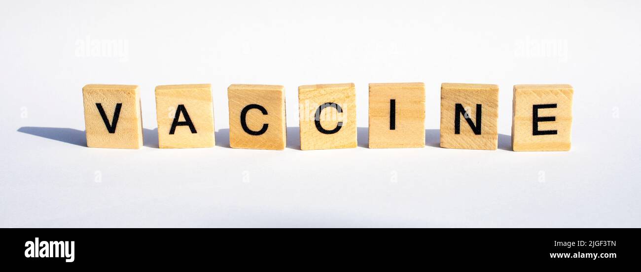 The word VACCINE, spelt with letter tiles Stock Photo - Alamy
