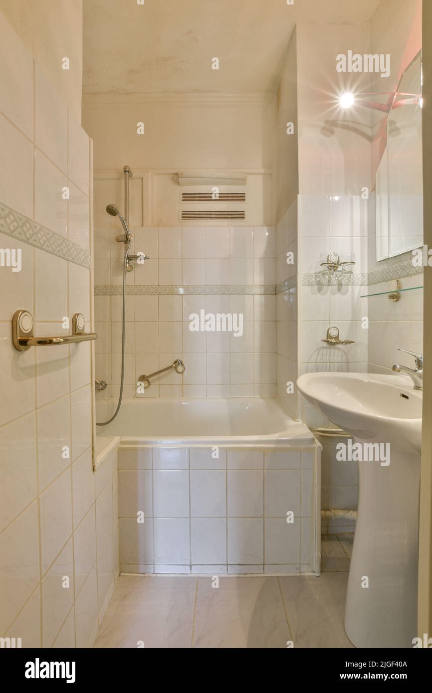 Modern home interior design of white bathroom with open bathtub and ...