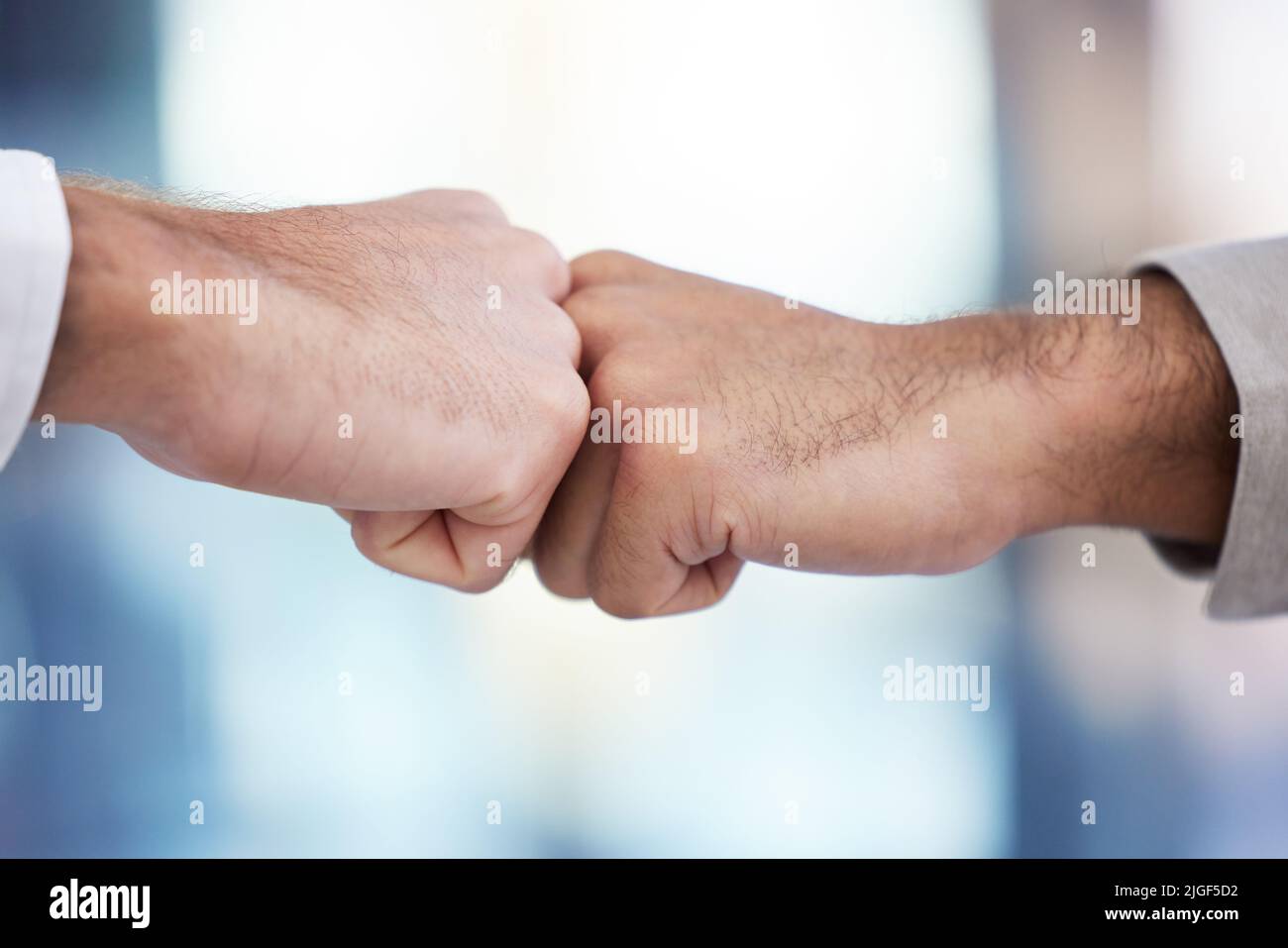 Together, well ride this wave. two unrecognizable businesspeople fist ...