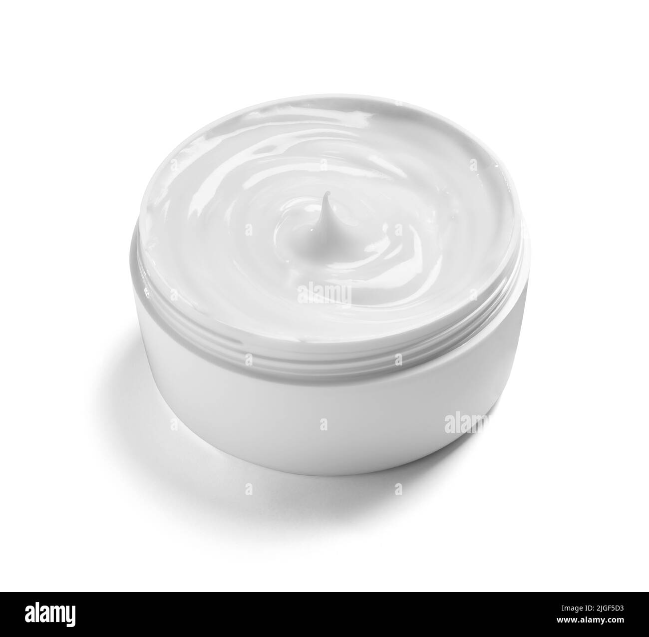 close up of a white beauty cream in a container on white background ...