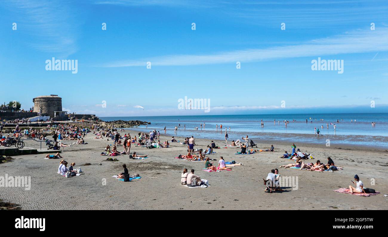 People enjoy the good weather at Seapoint beach in South Dublin on ...