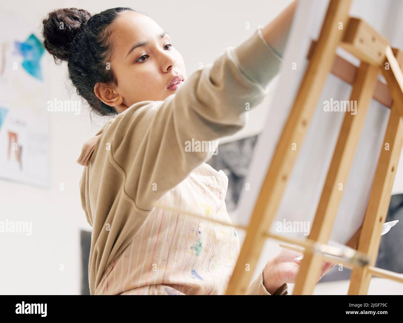 Letting the creativity flow. Low angle shot of an attractive young ...