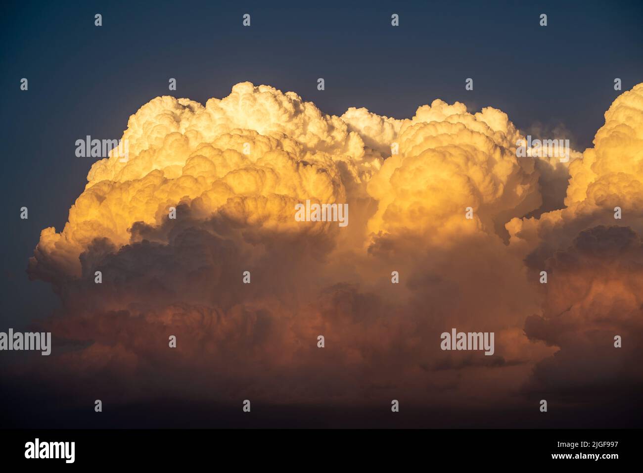 Thunderhead clouds form during the summer evening Stock Photo - Alamy