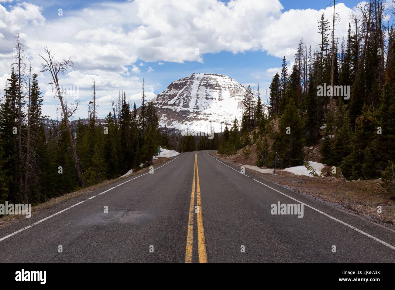 Scenic Road, Snowy Mountain and Trees. Spring Season Stock Photo - Alamy