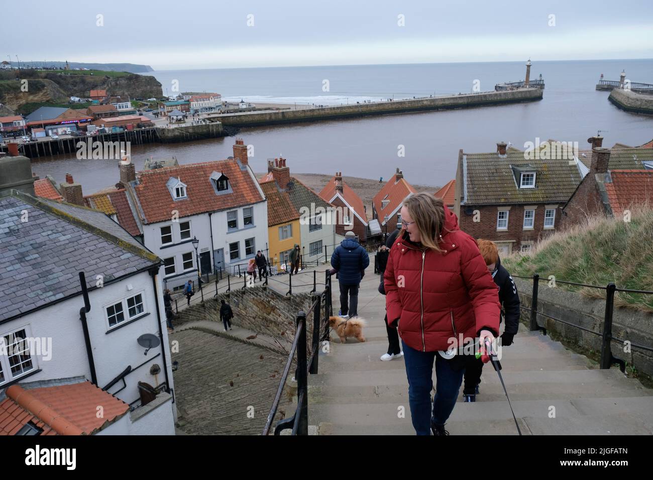Woman climbing Whitby's 199 steps Stock Photo - Alamy