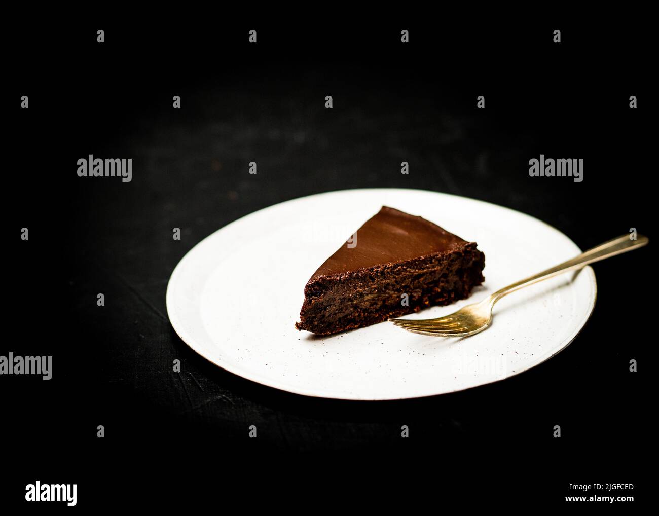 Flourless chocolate cake on a dark surface Stock Photo - Alamy
