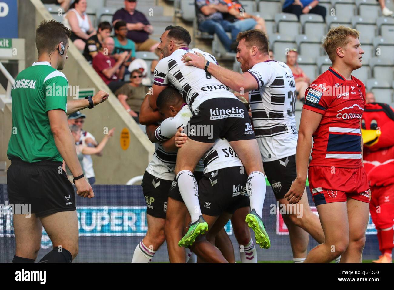 Connor Wynne #23 of Hull FC gets past Will Tate #28 of Hull KR to go ...