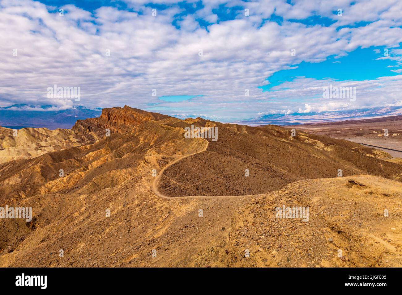 A narrow trail on a cliff edge in the California desert "Valley of ...