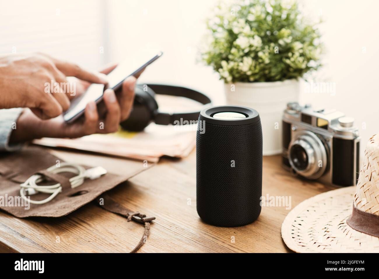 The man streams music from smartphone to bluetooth speaker Stock Photo ...