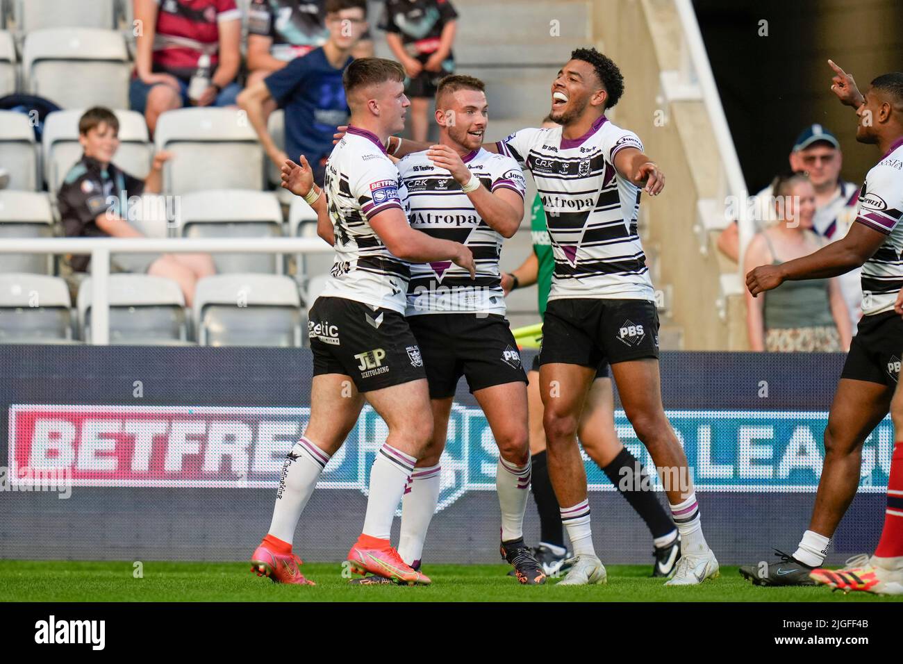 Darnell McIntosh #5 of Hull FC celebrates with try scorer Connor Wynne ...