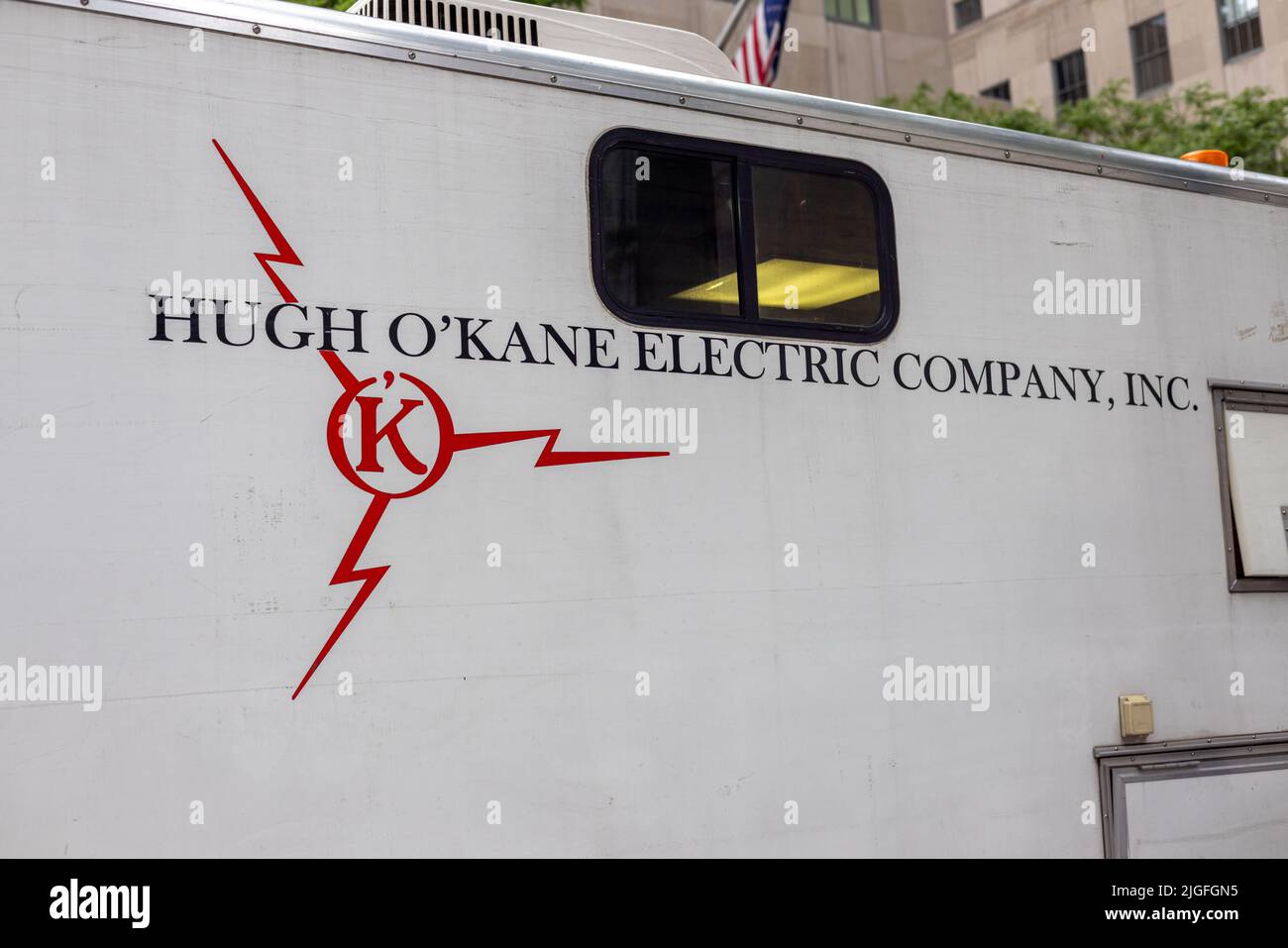 A closeup of an electric maintenance vehicle of Hugh O' Kane company ...