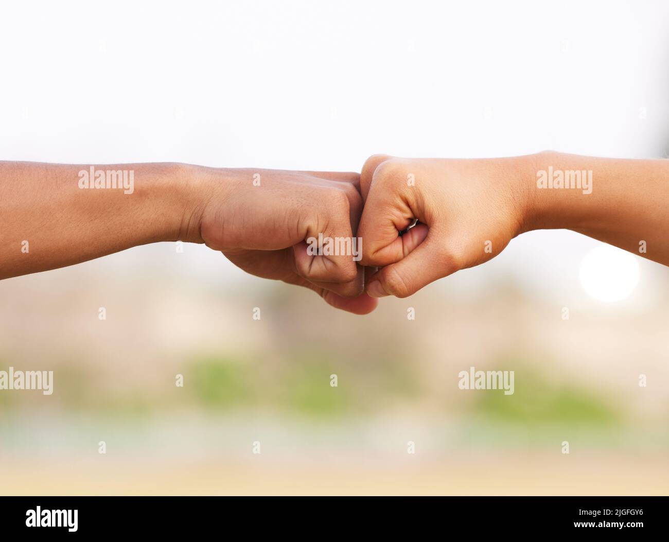 Believe in yourself you got this. two people fist bumping during a ...