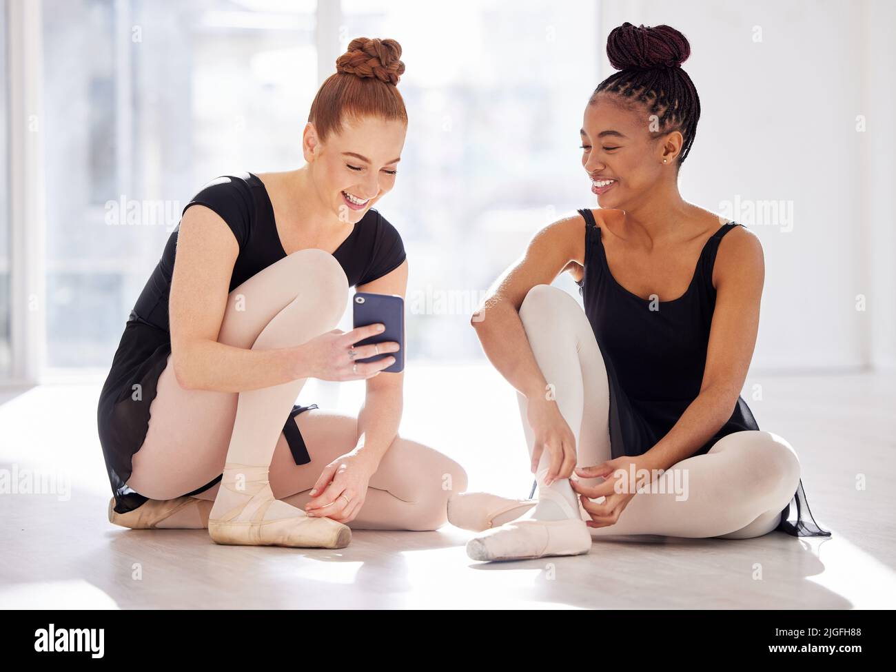 I think you should send it. a ballet dancer showing her friend her ...