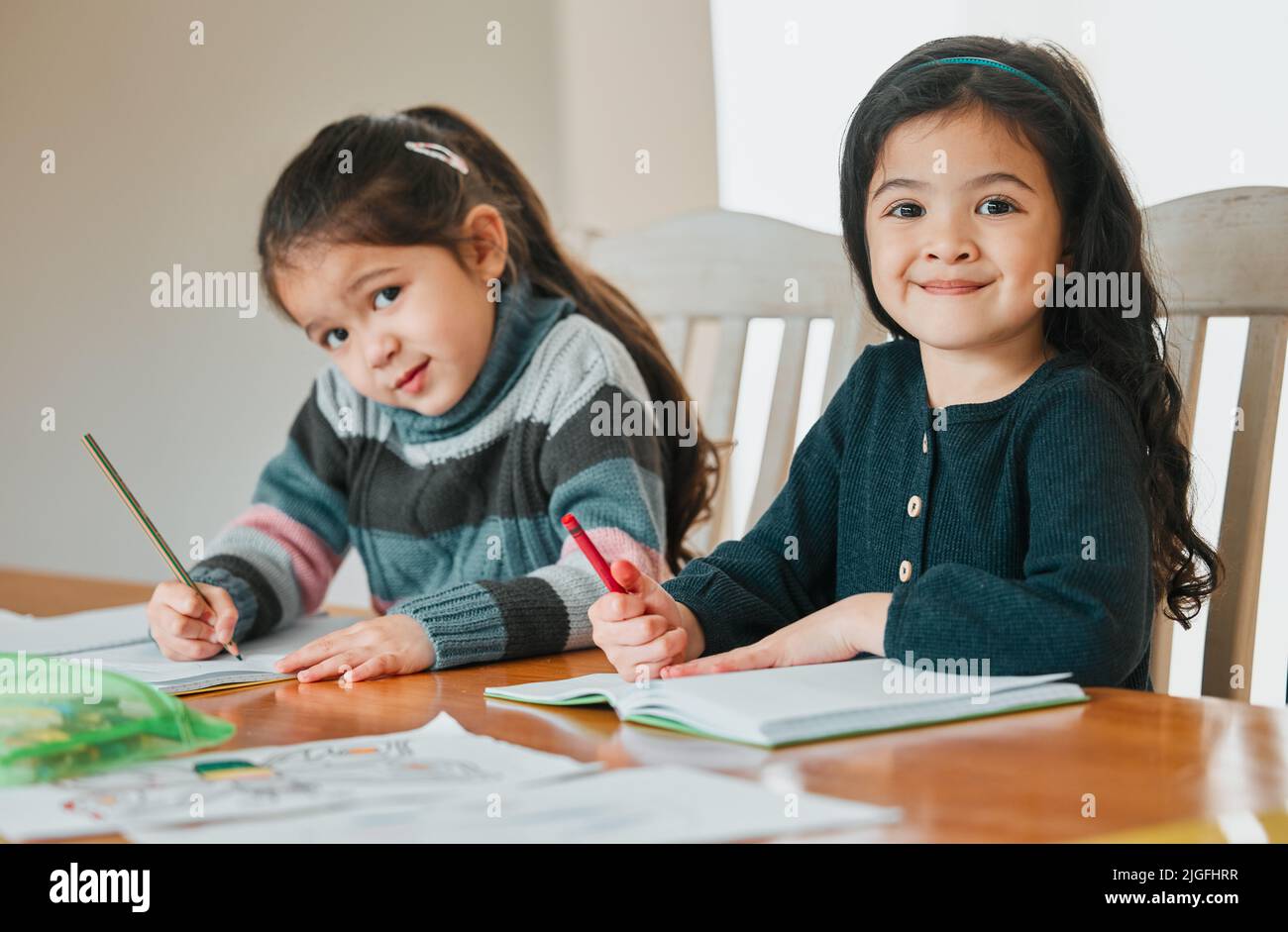 Learning with my sister is the best. two sisters completing their ...