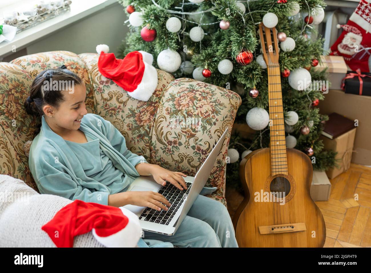 Christmas distance learning online education. Schoolgirl studying at ...