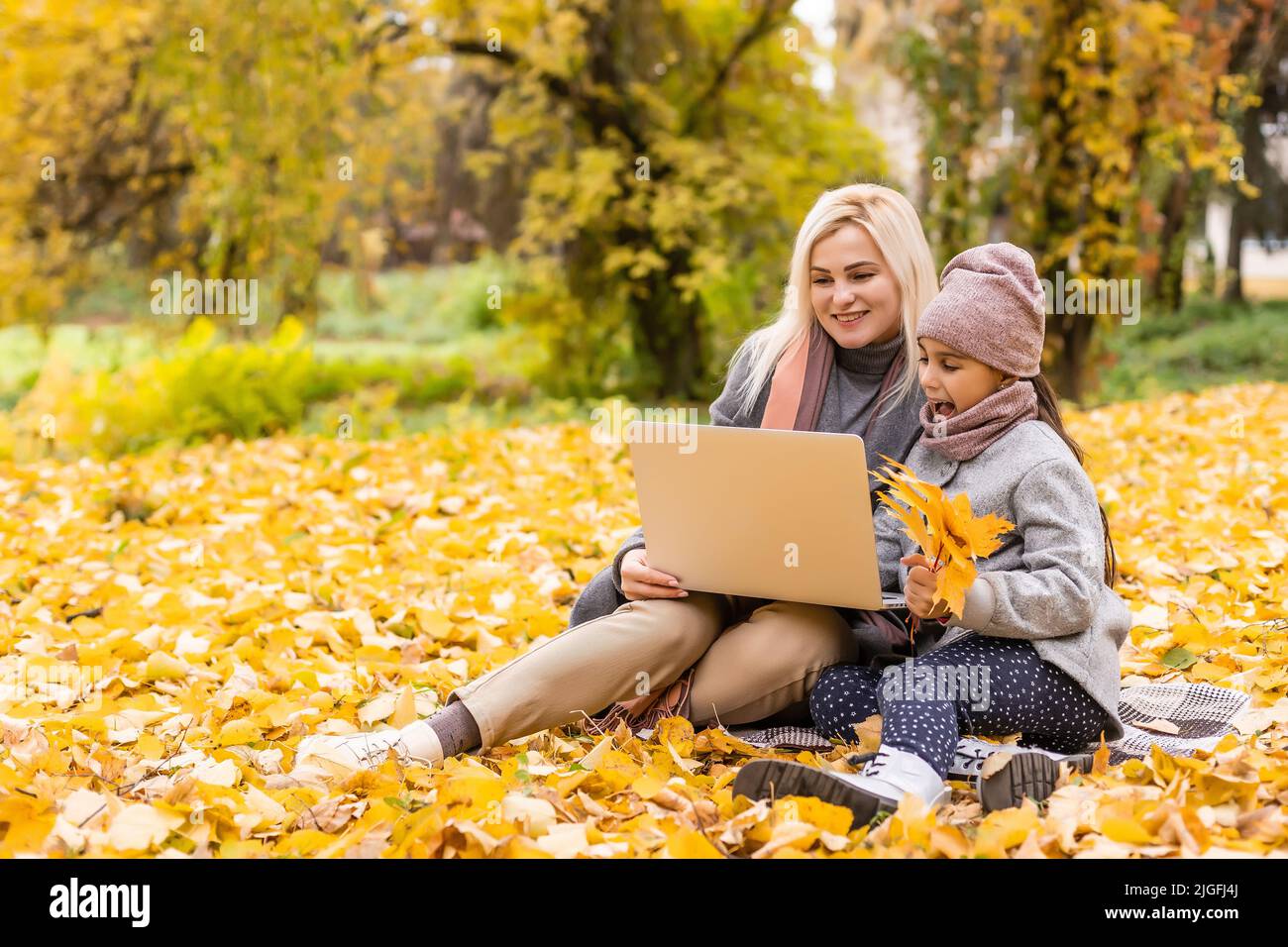 Online communication. Family using laptop and video calling , sitting ...