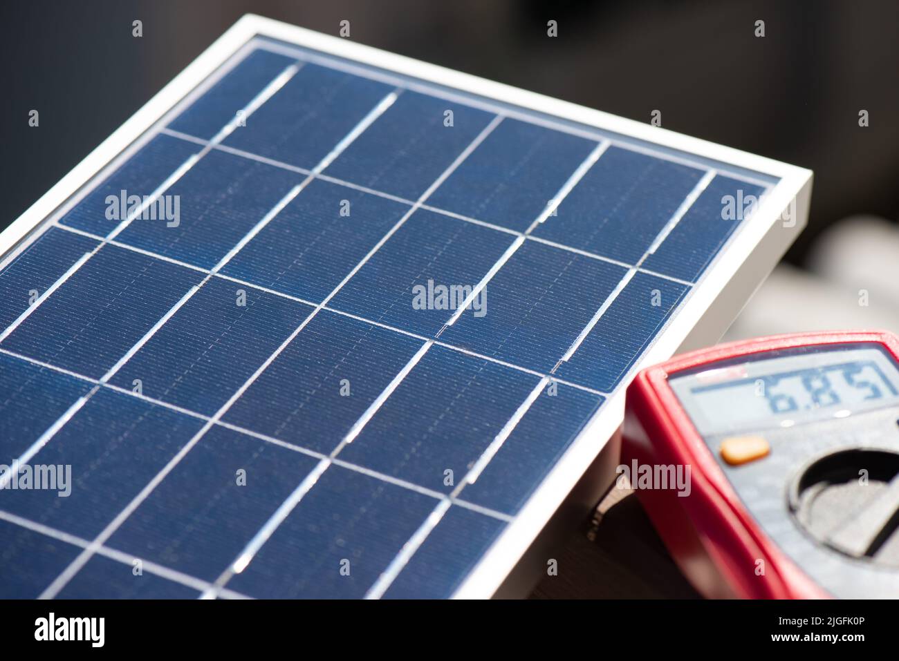 Photovoltaic or solar cell panel with multimeter. green energy concept ...