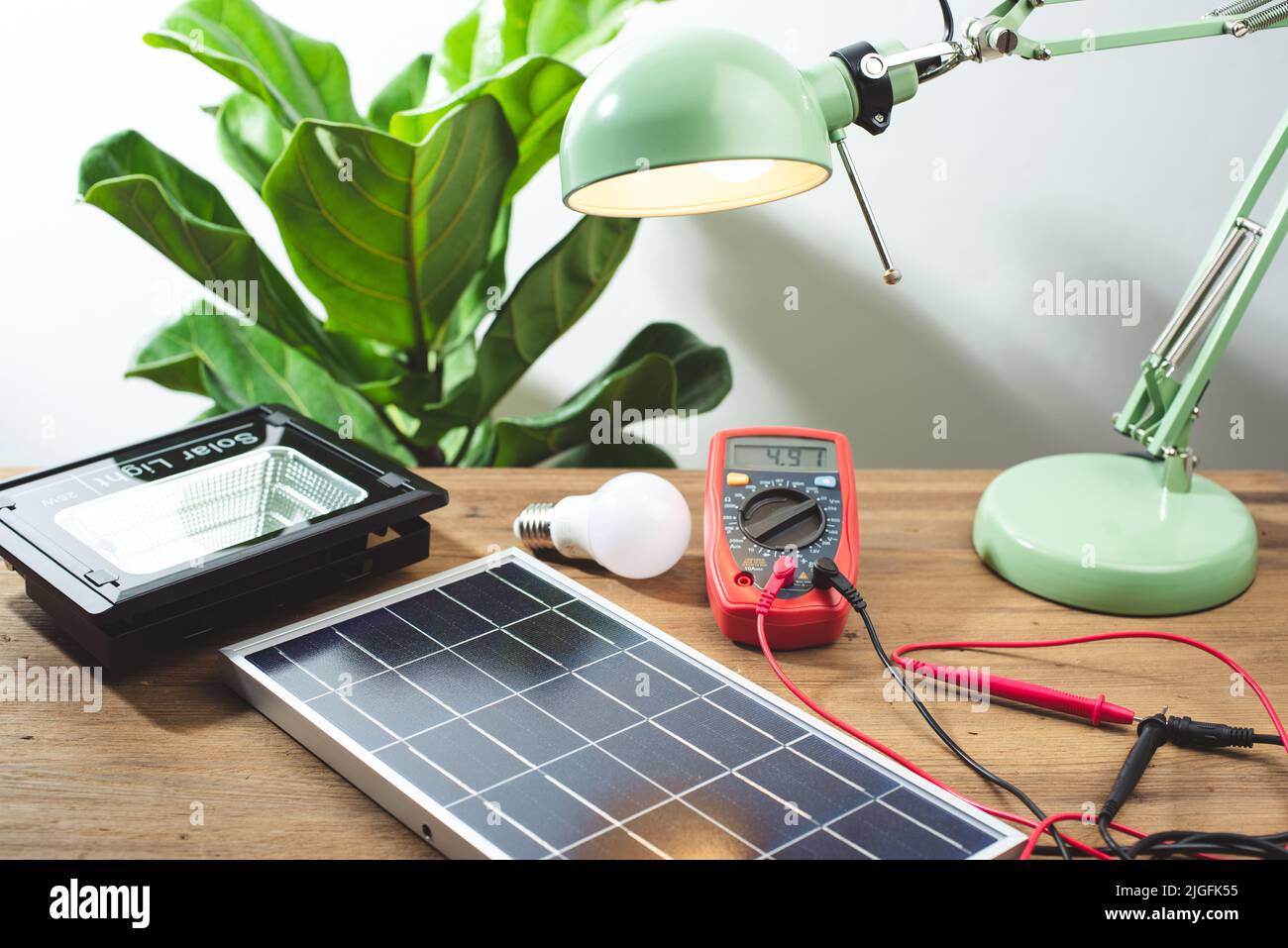 Photovoltaic or solar cell panel with multimeter. green energy concept ...