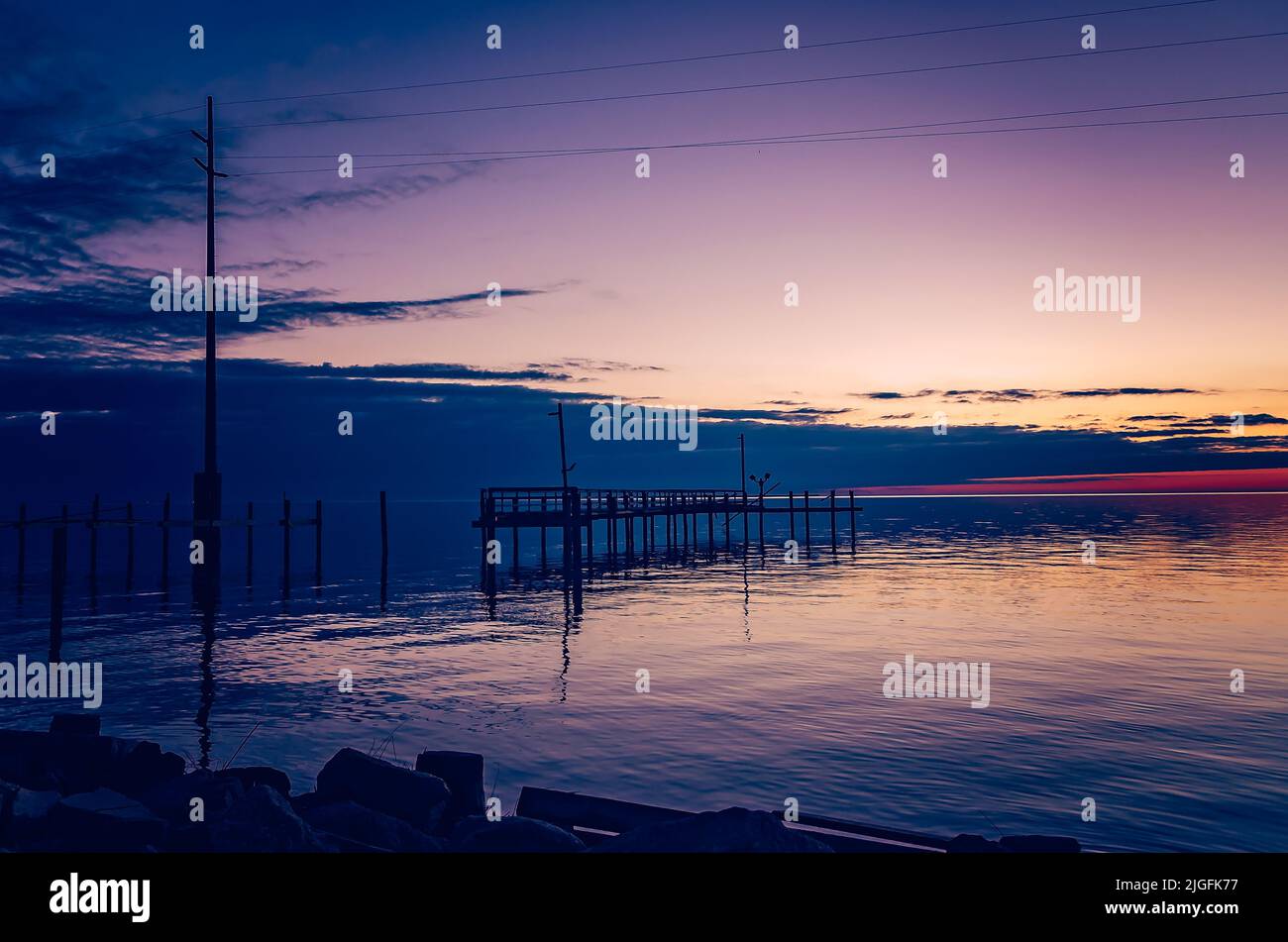 The sun sets over Heron Bay at Cedar Point, Oct. 31, 2020, in Coden ...