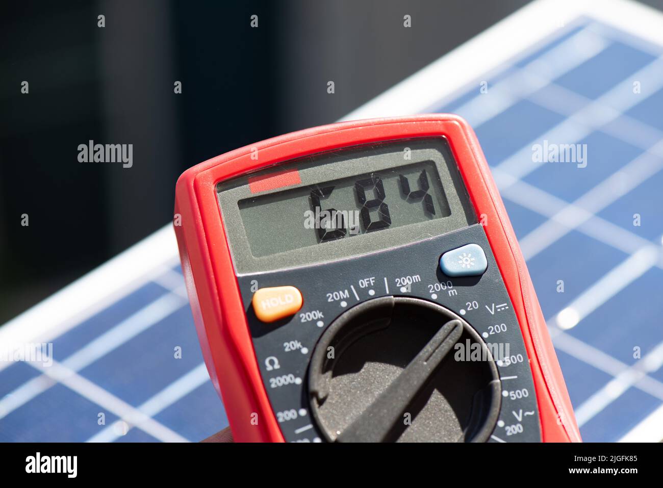 Photovoltaic or solar cell panel with multimeter. green energy concept ...