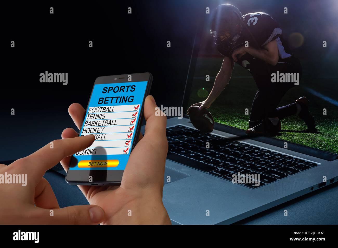 Football player looking cell phone hi-res stock photography and images - Alamy