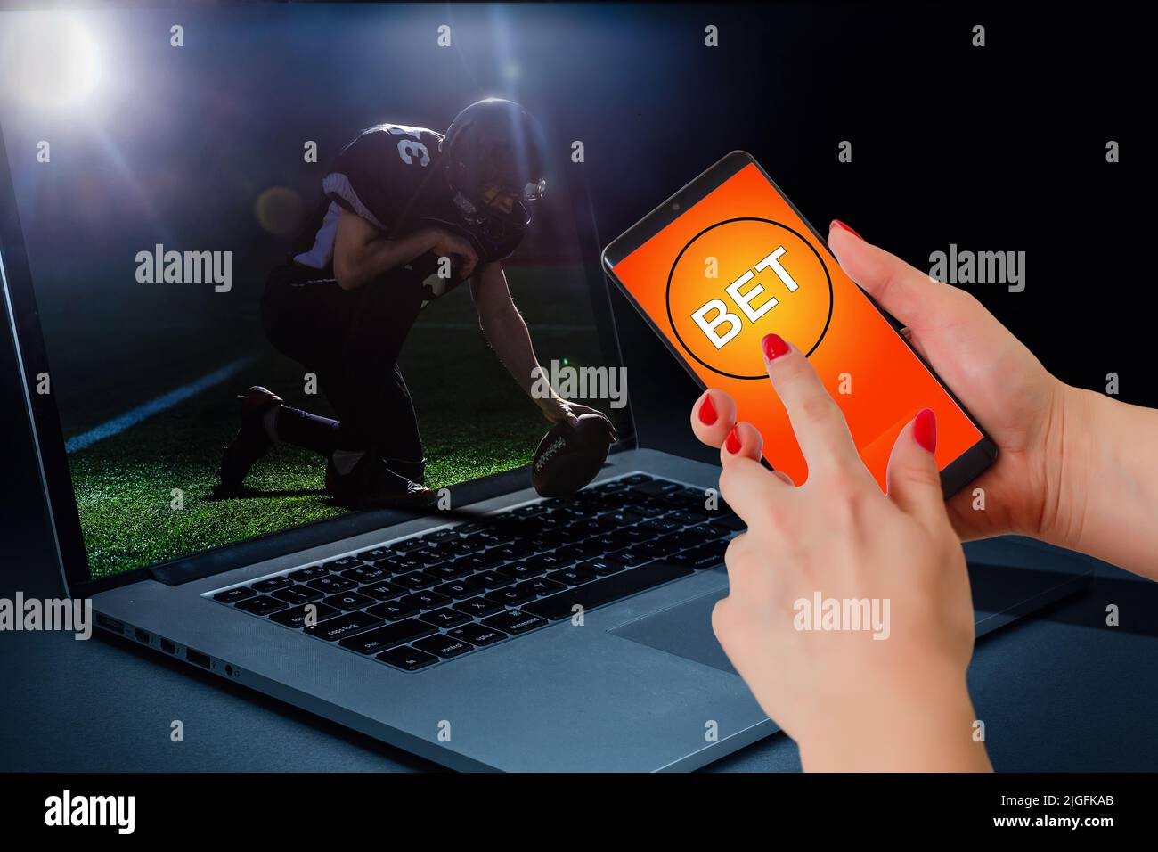 mobile phone and betting during a american football match Stock Photo ...