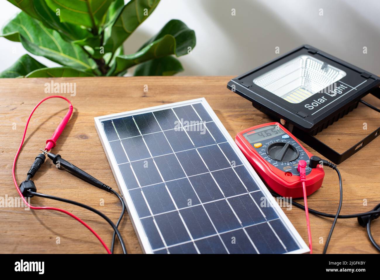 Photovoltaic or solar cell panel with multimeter. green energy concept ...