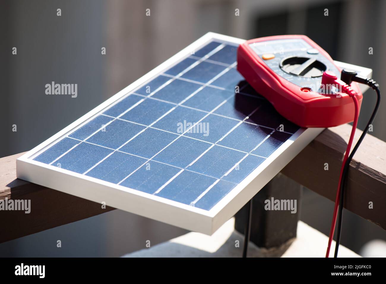 Photovoltaic or solar cell panel with multimeter. green energy concept ...