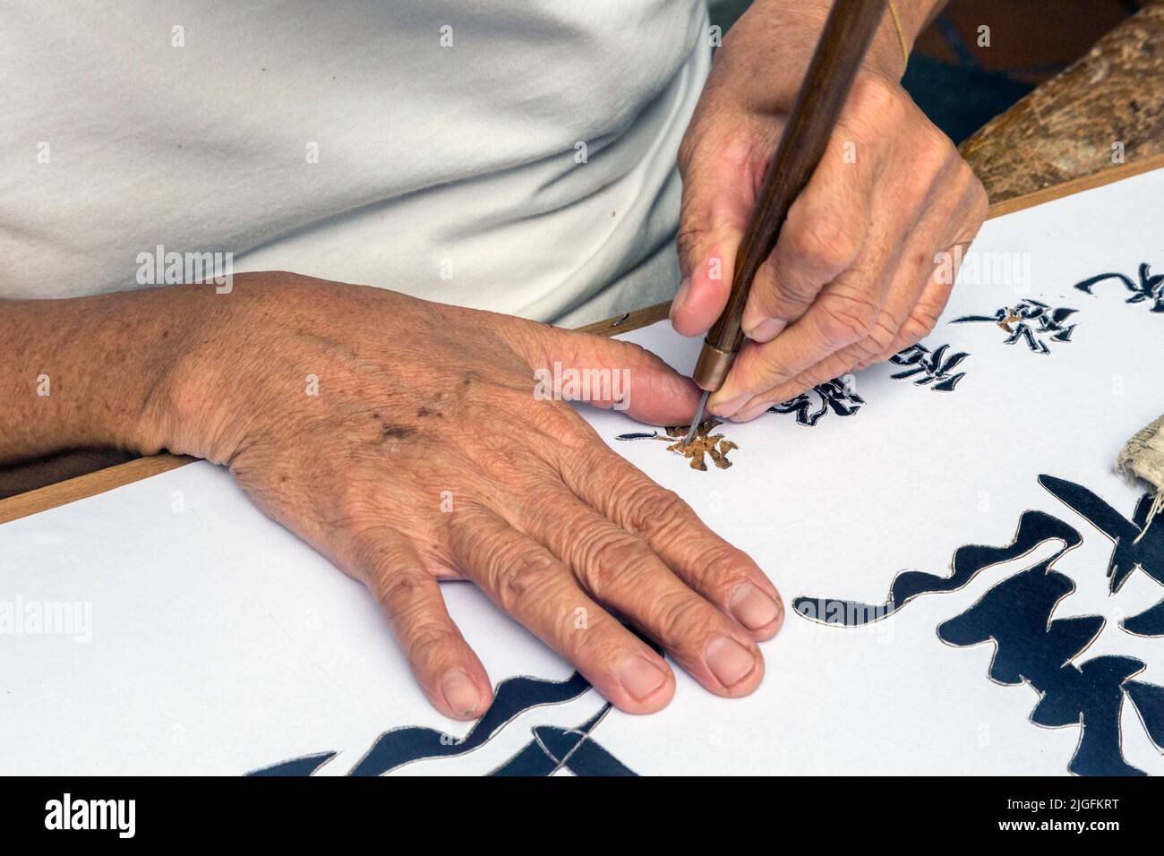 Hands of Chinese artisan at work at the Yong Gallery, Republic of ...