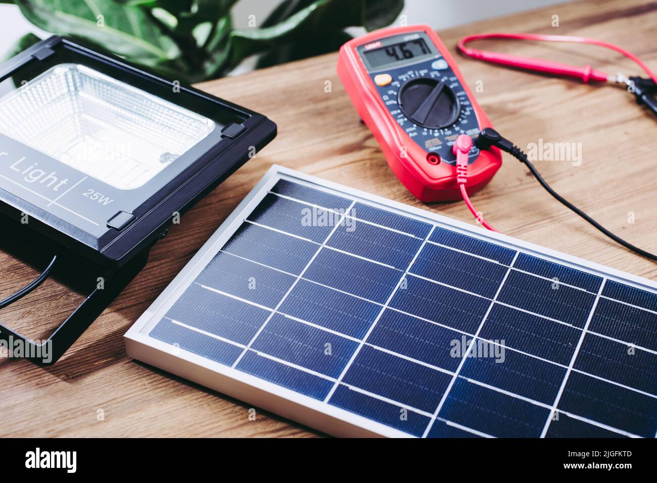 Photovoltaic or solar cell panel with multimeter. green energy concept ...