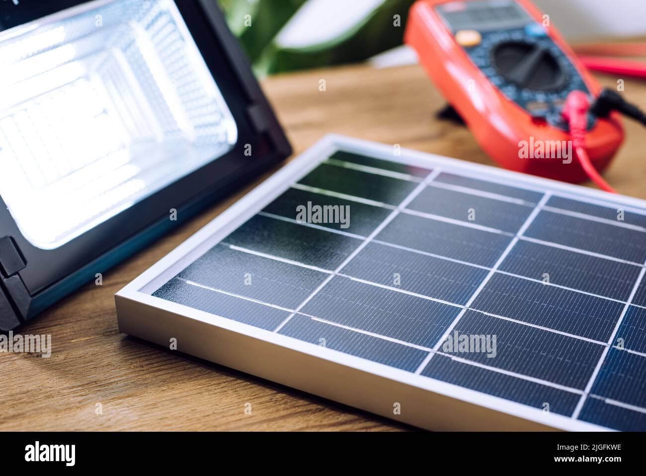 Photovoltaic or solar cell panel with multimeter. green energy concept ...