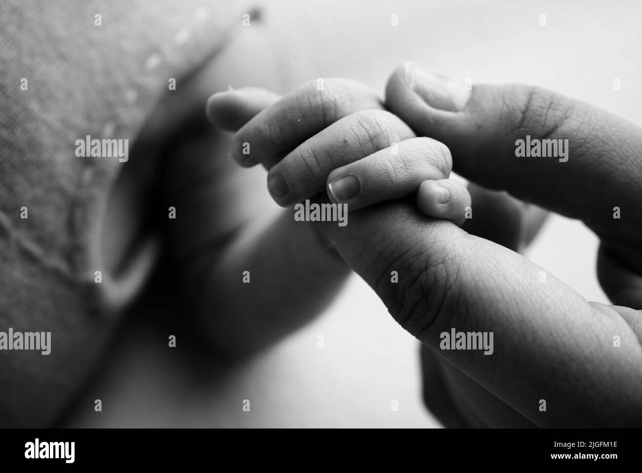 Infant grip Black and White Stock Photos & Images - Alamy