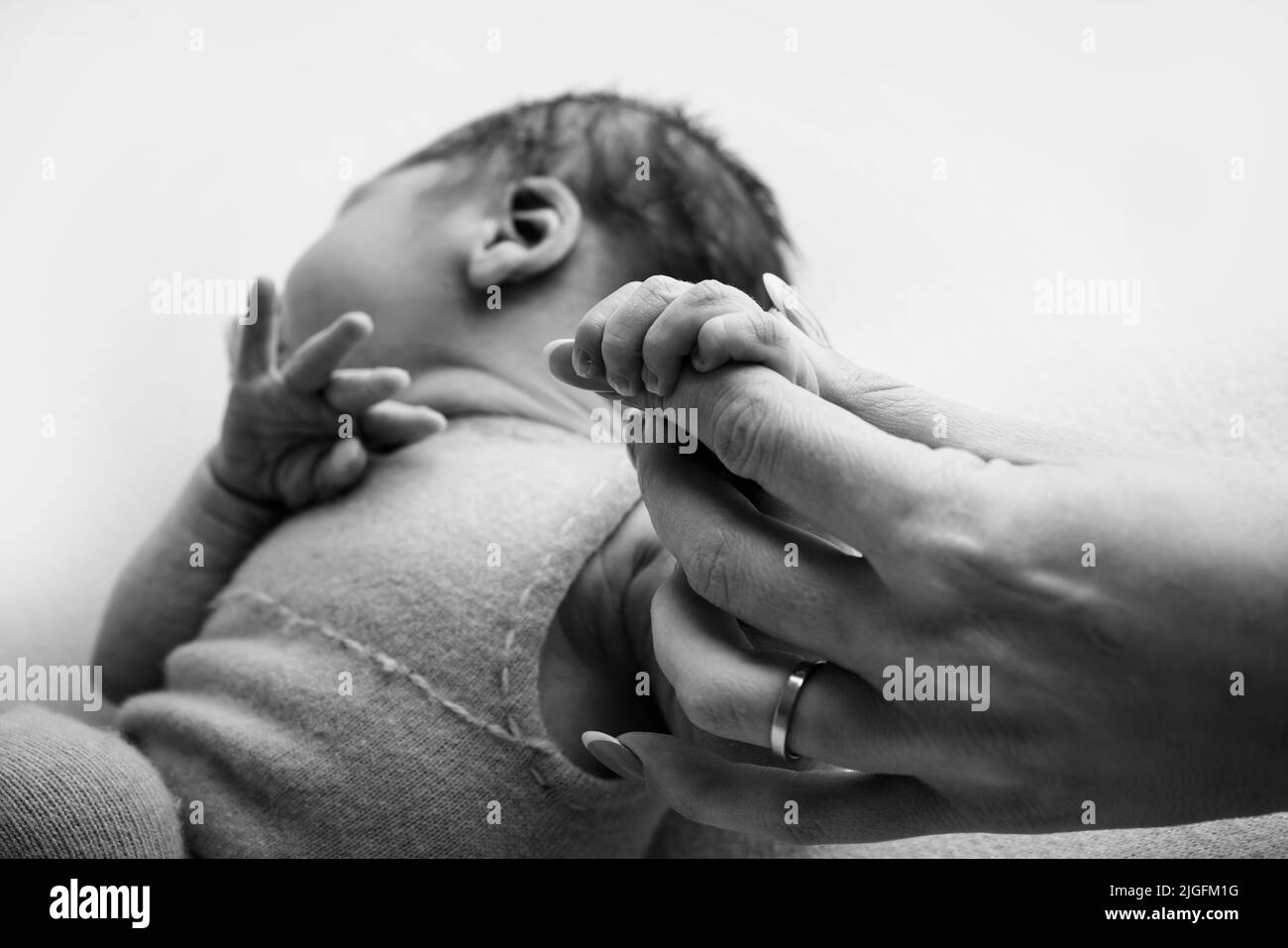 Close-up little hand of child and palm of mother and father. The ...