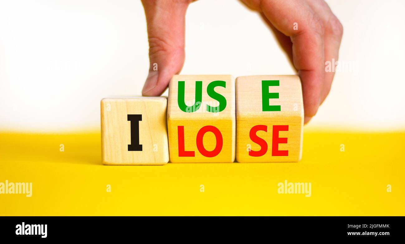I use or lose it symbol. Concept words I use and I lose on wooden cubes ...
