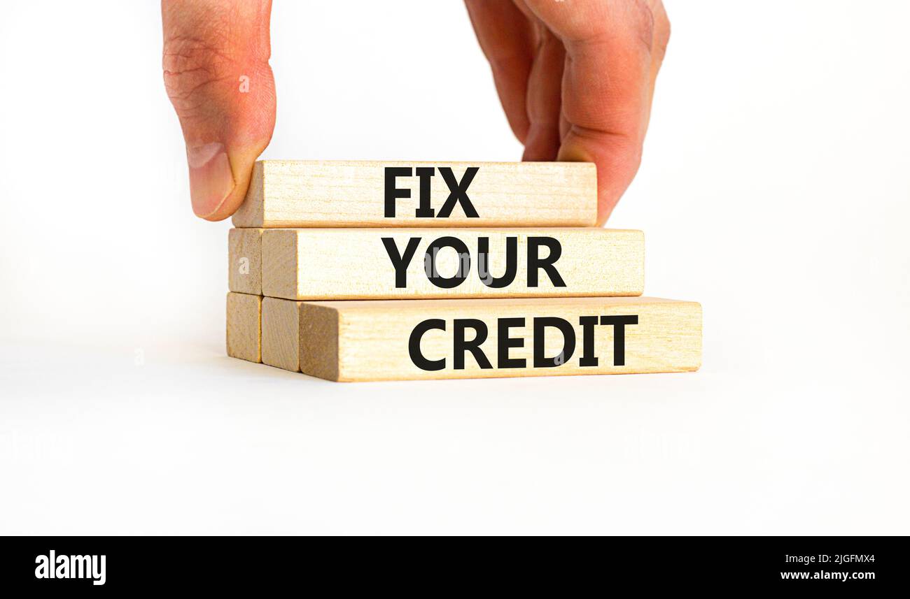 Fix your credit symbol. Concept words Fix your credit on wooden blocks ...