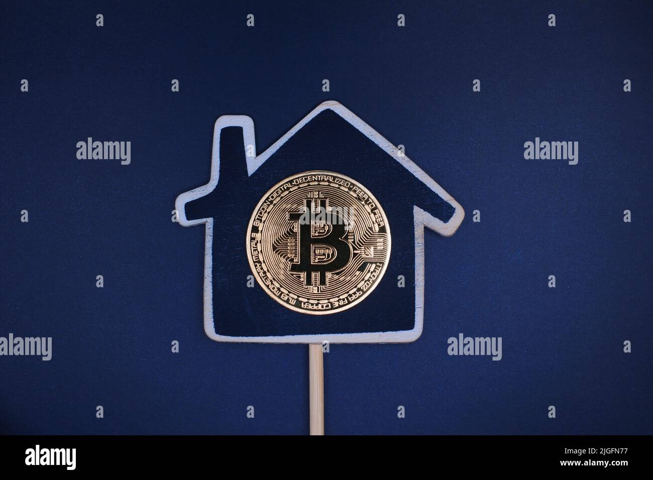 House shape with a bitcoin inside Stock Photo - Alamy