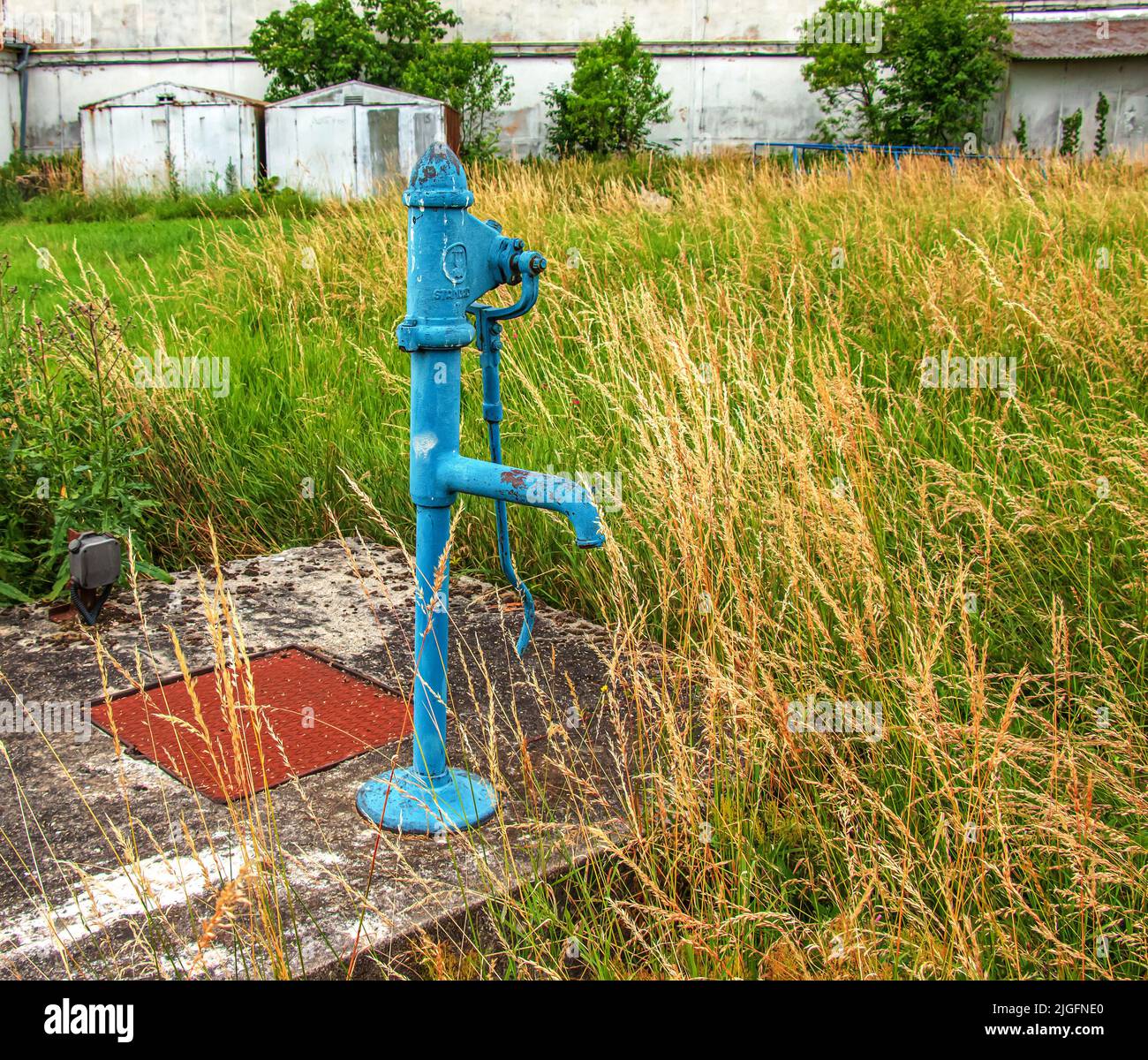 Retro borehole pump on a sunny day, old manual water pump (lever pump ...